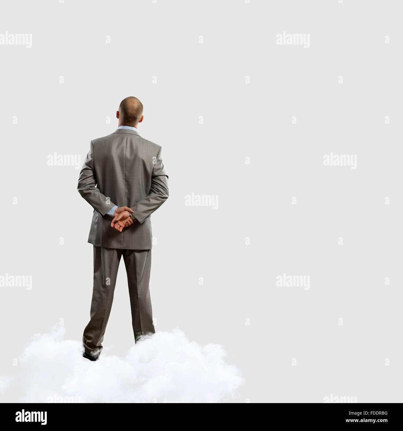 Back view image of businessman with arms crossed behind back. Place for ...