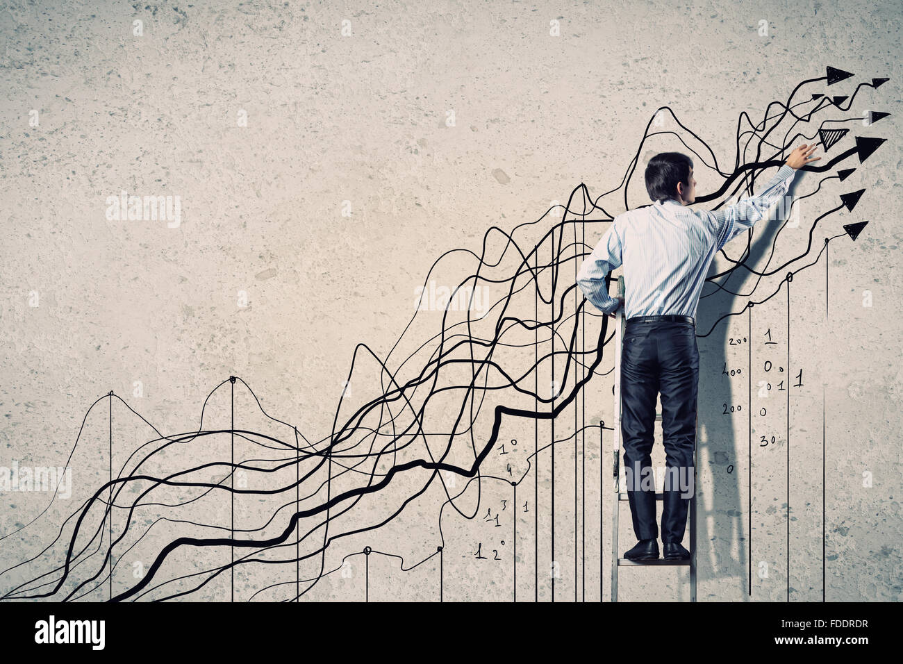 Back view image of businessman drawing graphics on wall Stock Photo - Alamy