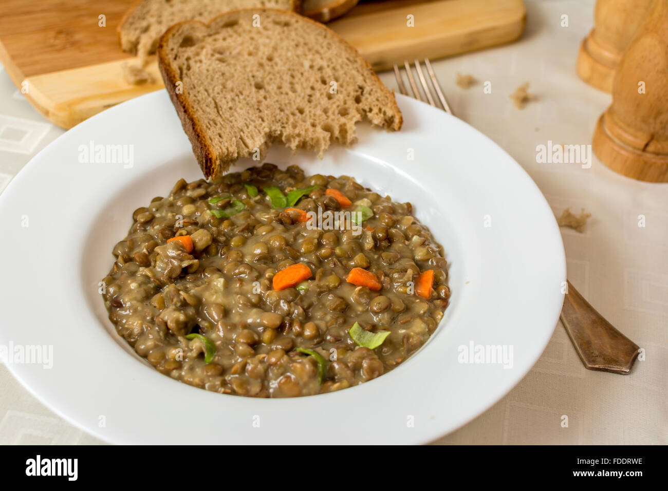 Traditional lentils or lens with vegetables and bread Stock Photo - Alamy