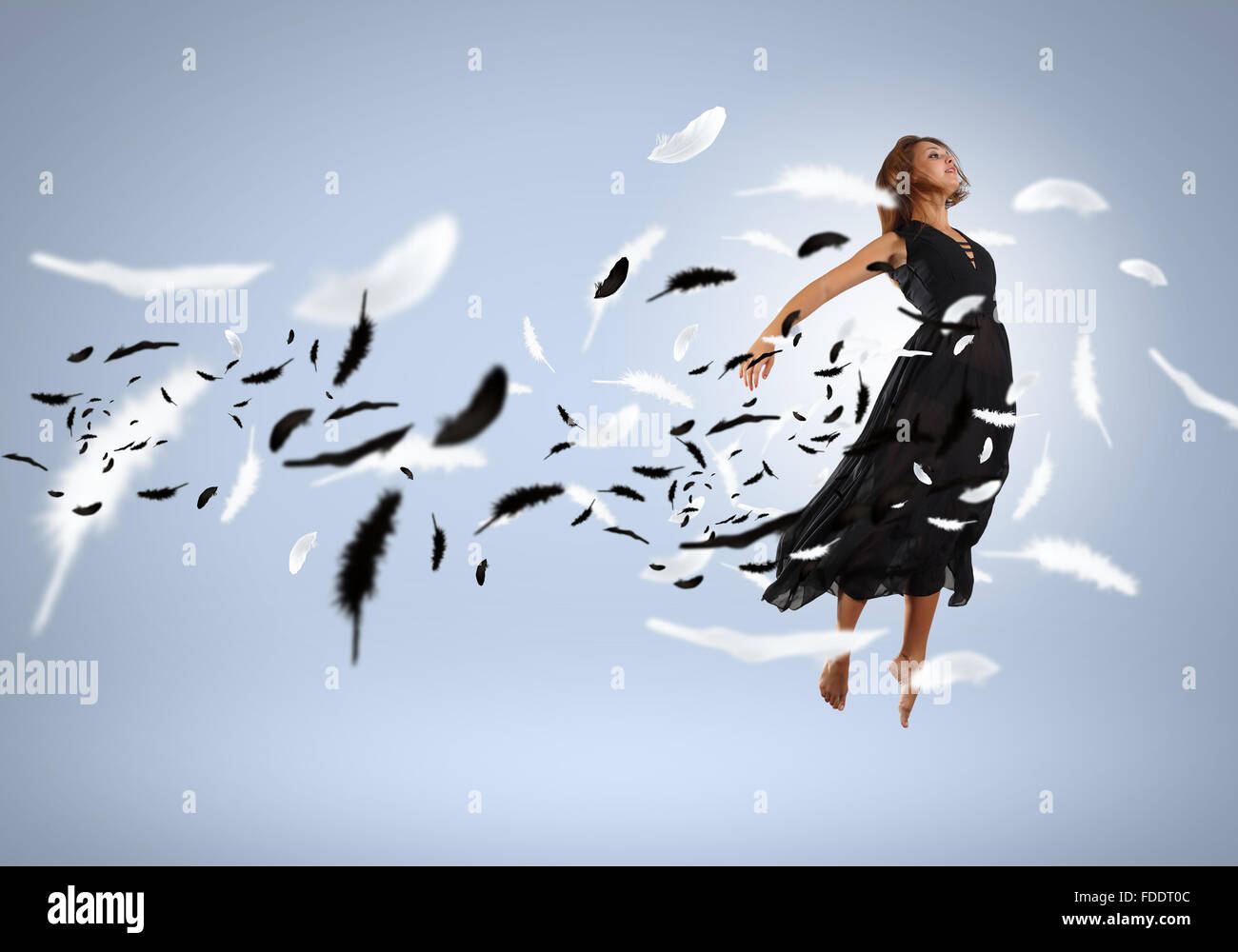 Young girl flying among the feathers like a bird Stock Photo - Alamy