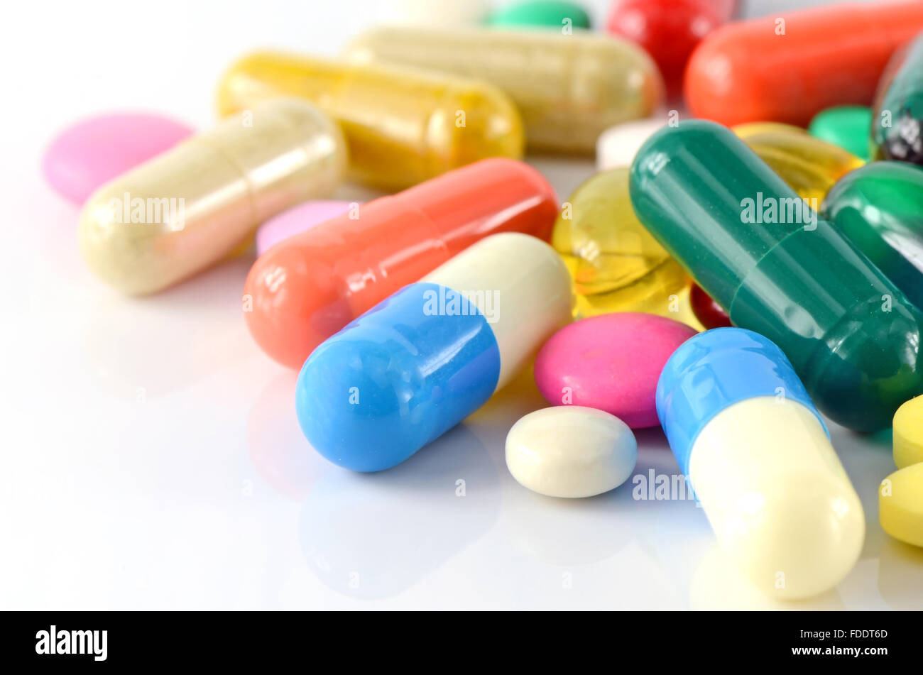 Colorful of oral medications on White Background Stock Photo - Alamy