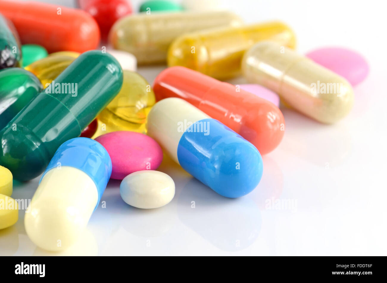 Colorful of oral medications on White Background Stock Photo - Alamy