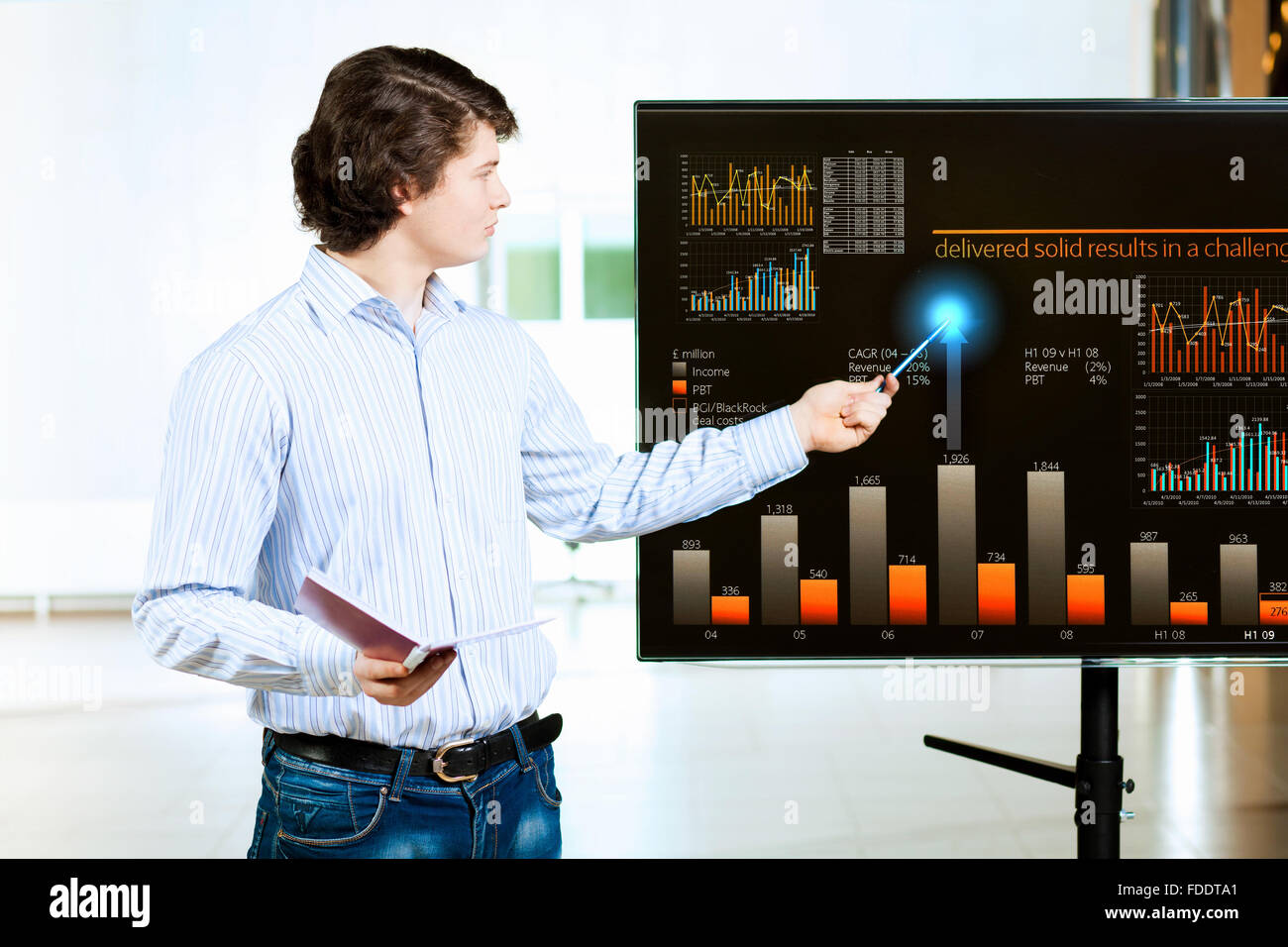 Image of young man making presentation on screen Stock Photo - Alamy