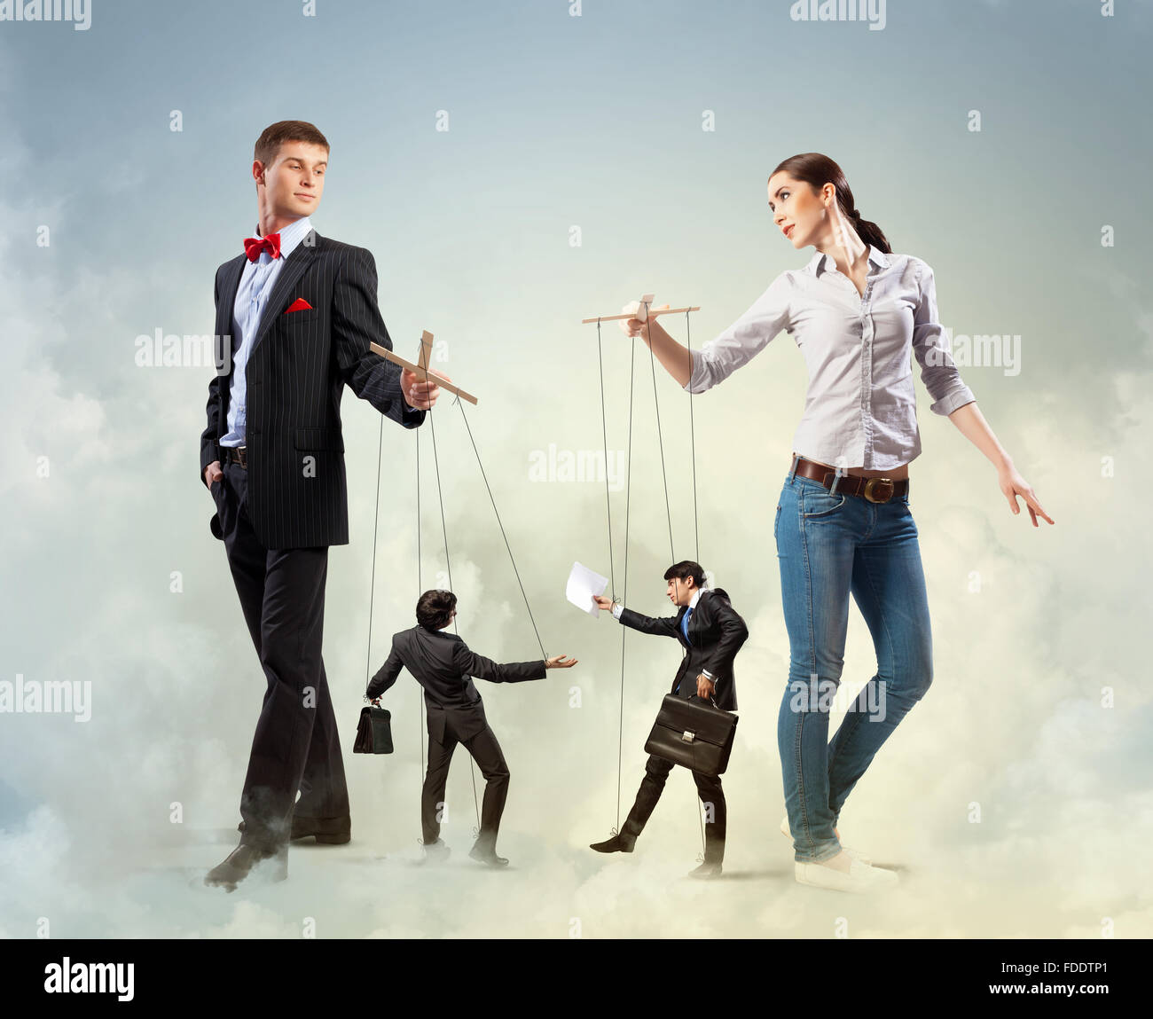 Image of man and woman with marionette puppets Stock Photo - Alamy