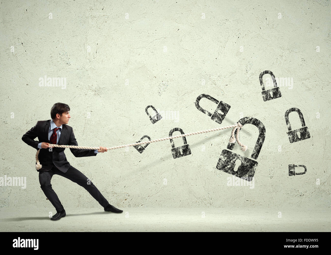 Image of young businessman pulling ock sign rope with l Stock Photo - Alamy