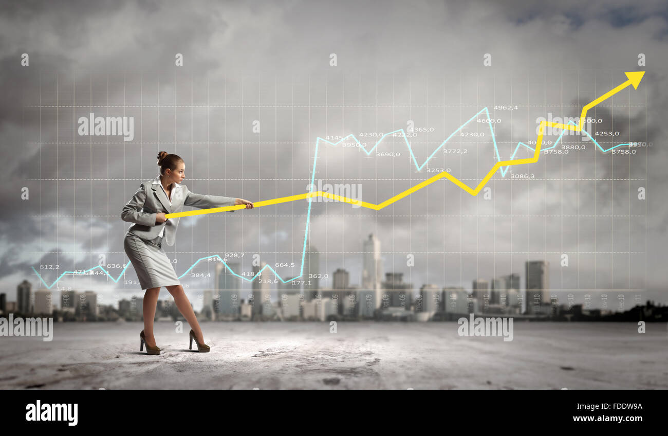 Image of businesswoman pulling graph of diagram Stock Photo - Alamy
