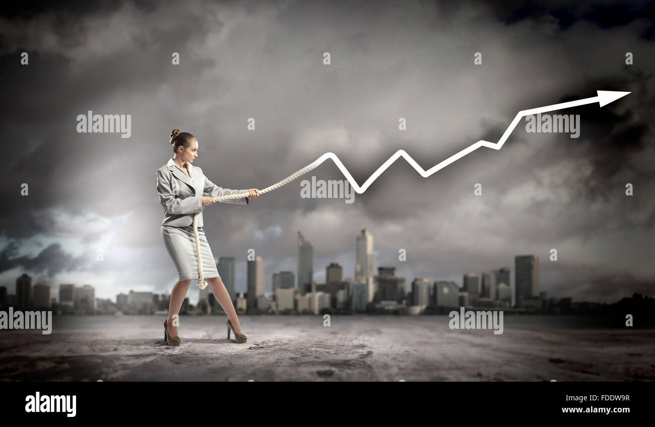 Image of businesswoman pulling graph of diagram Stock Photo - Alamy