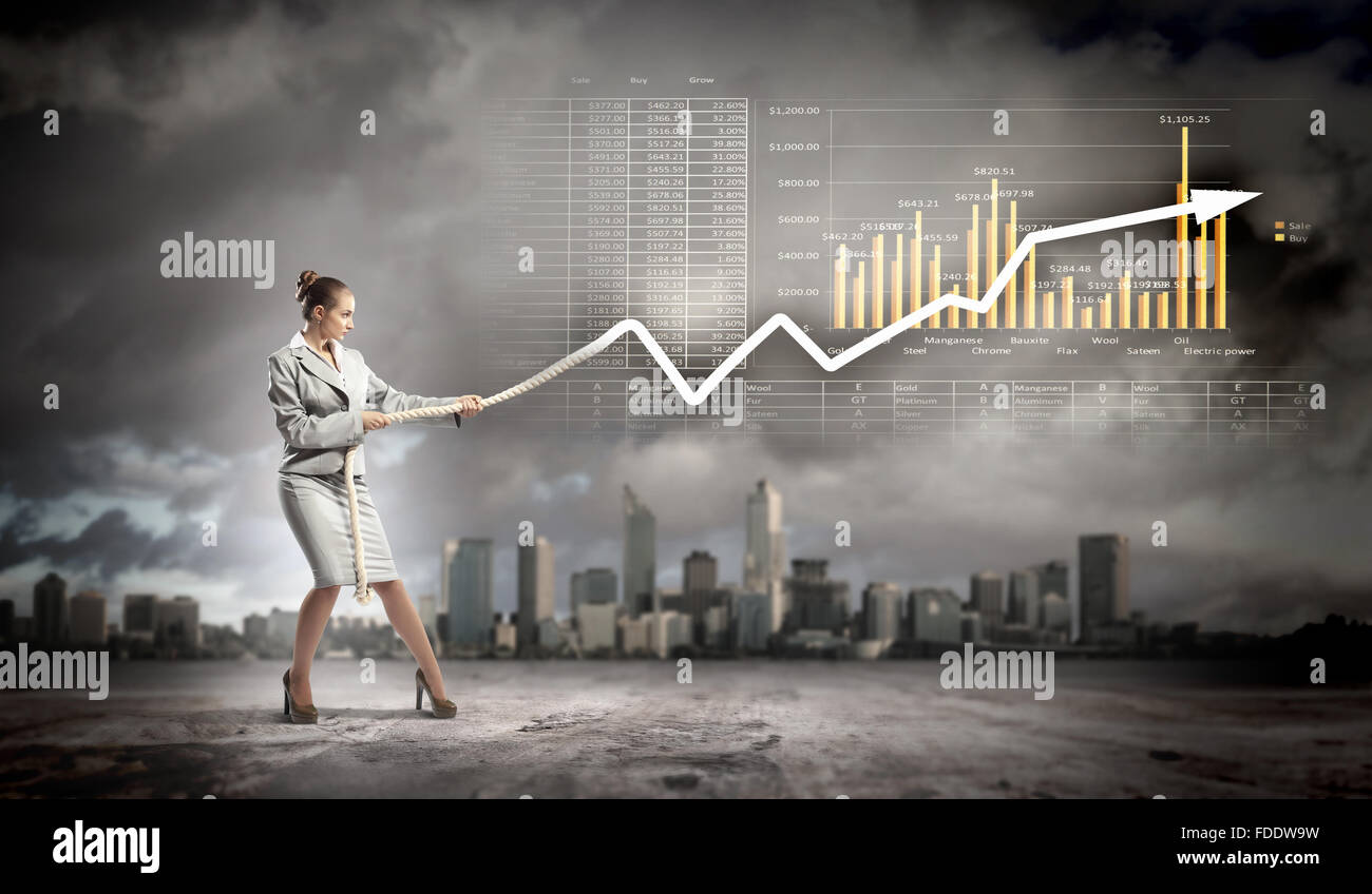Image of businesswoman pulling graph of diagram Stock Photo - Alamy