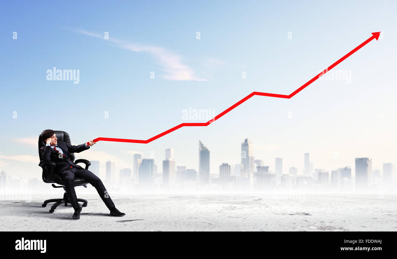 Image of young businessman pulling graph. Chart growth concept Stock ...