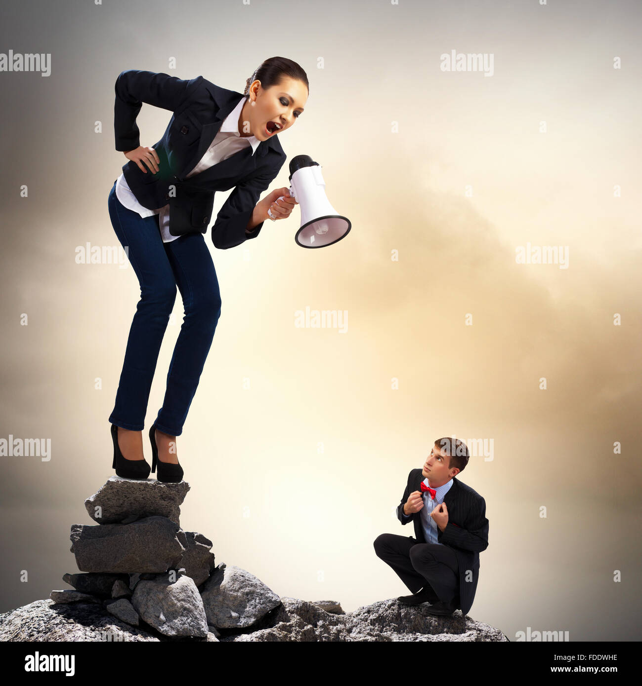 Angry businesswoman with megaphone shouting at colleague Stock Photo ...
