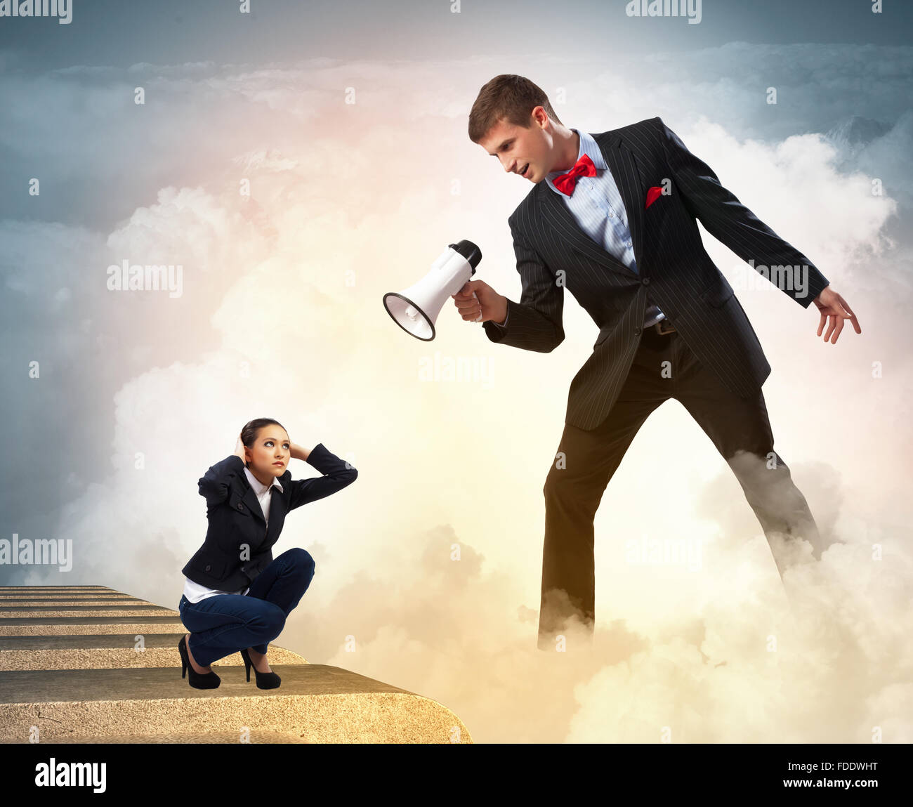 Angry businessman with megaphone shouting at colleague Stock Photo - Alamy