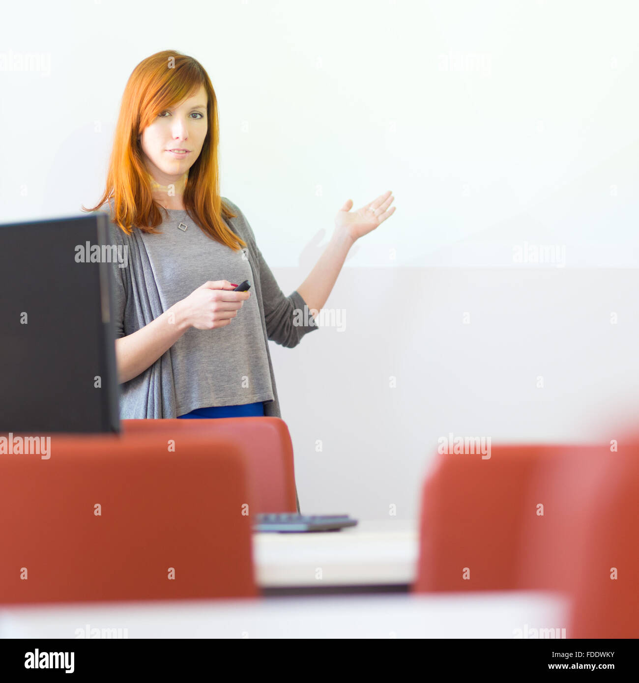 Businesswoman giving a talk Stock Photo - Alamy