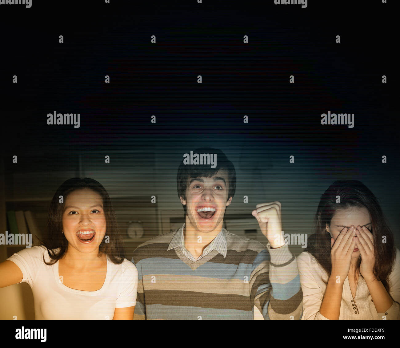 Young people watching football match on telly Stock Photo - Alamy