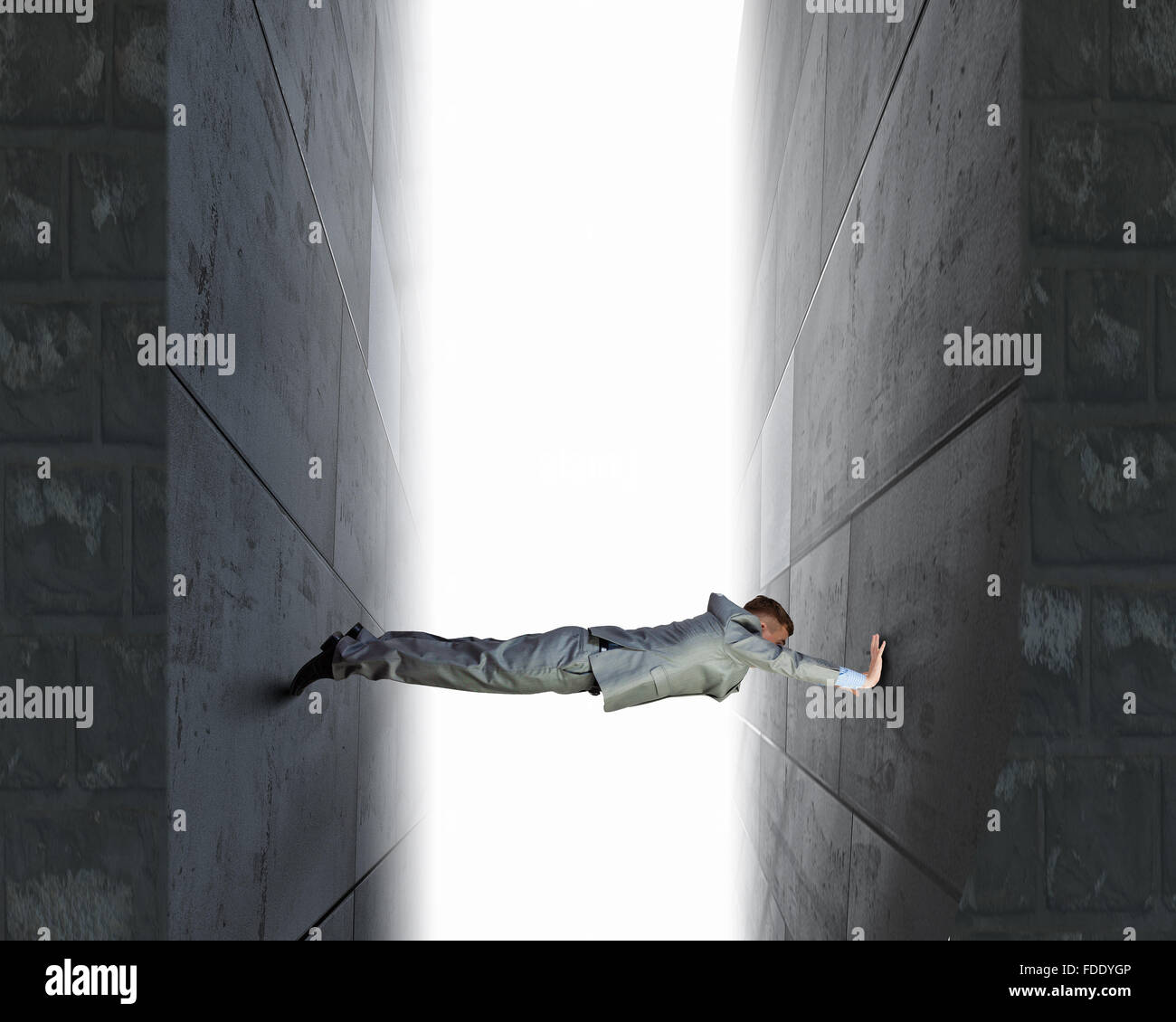 Young troubled businessman trapped between two walls Stock Photo - Alamy