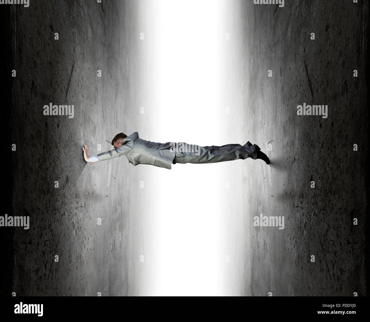 Young troubled businessman trapped between two walls Stock Photo - Alamy