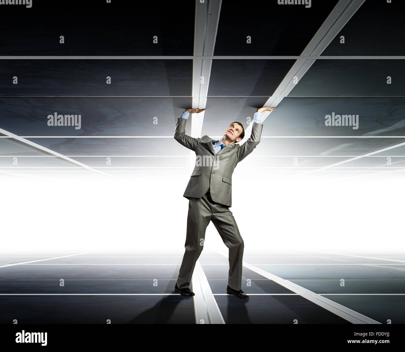 Young troubled businessman trapped between two walls Stock Photo - Alamy