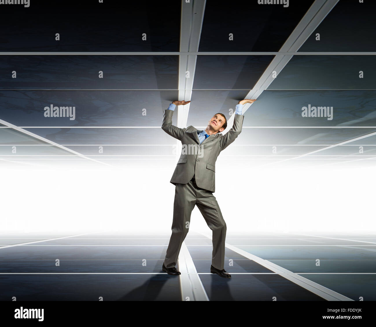 Young troubled businessman trapped between two walls Stock Photo - Alamy