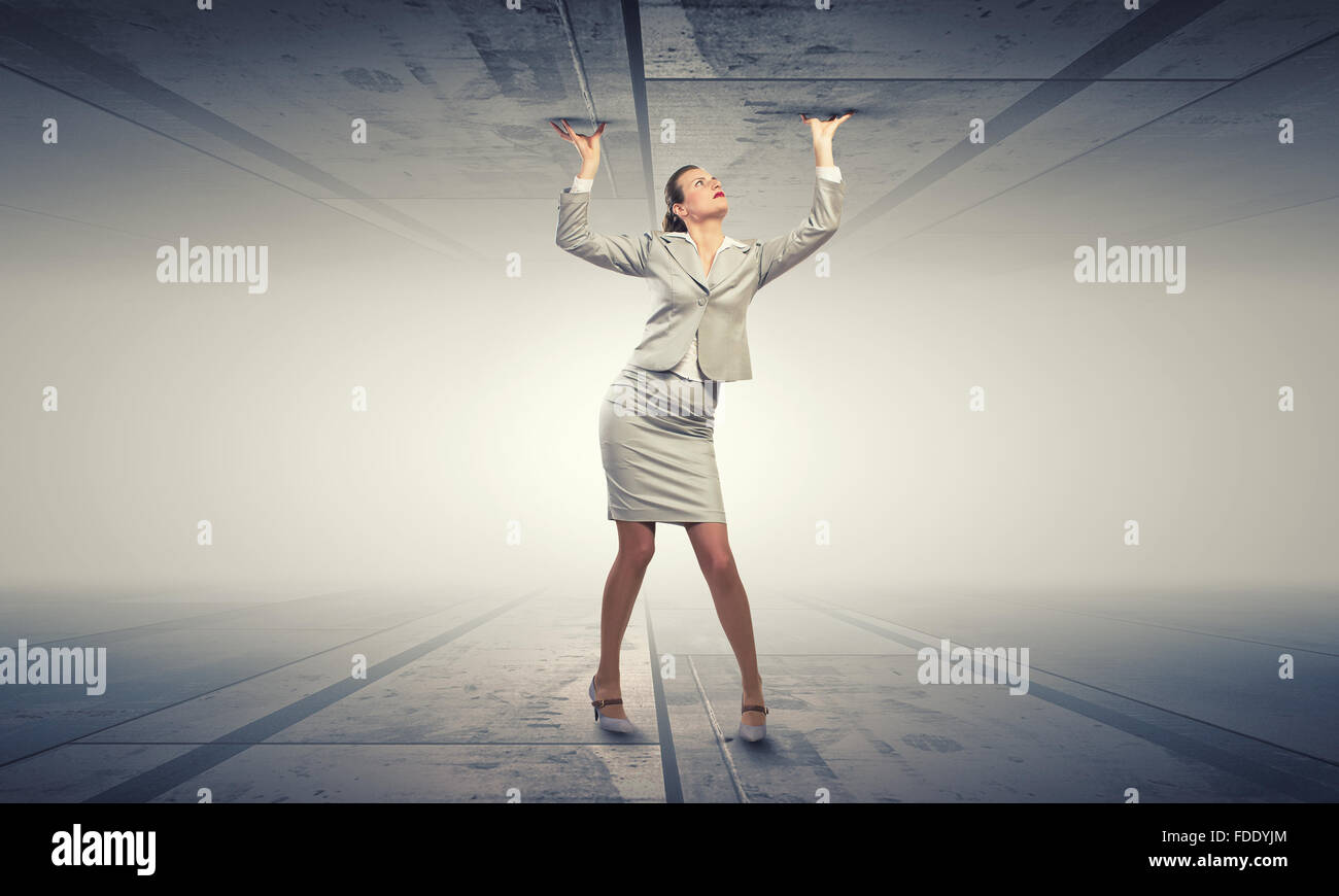 Young troubled businesswoman trapped between two walls Stock Photo - Alamy