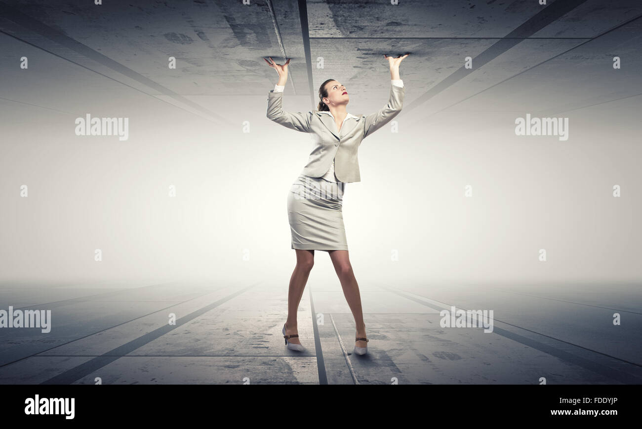 Young troubled businesswoman trapped between two walls Stock Photo - Alamy
