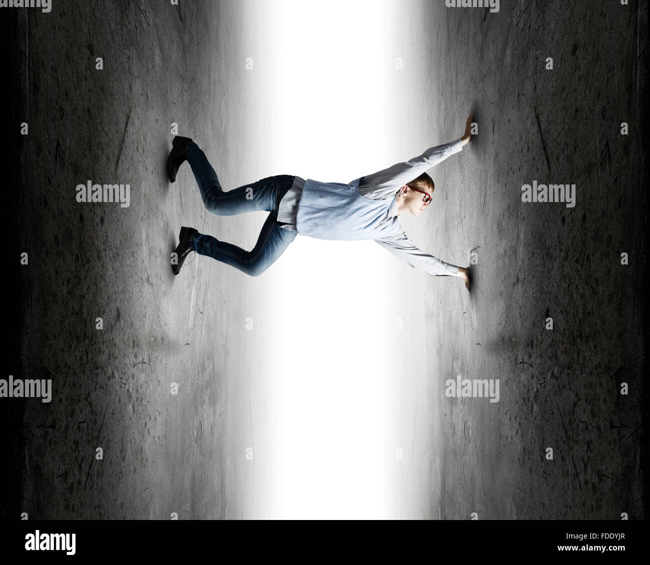 Young troubled businessman trapped between two walls Stock Photo - Alamy