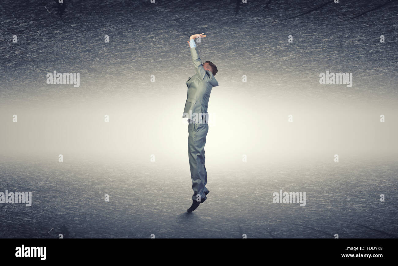 Young troubled businessman trapped between two walls Stock Photo - Alamy
