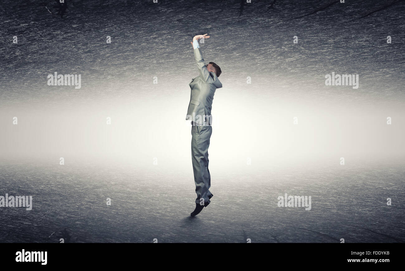 Young troubled businessman trapped between two walls Stock Photo - Alamy