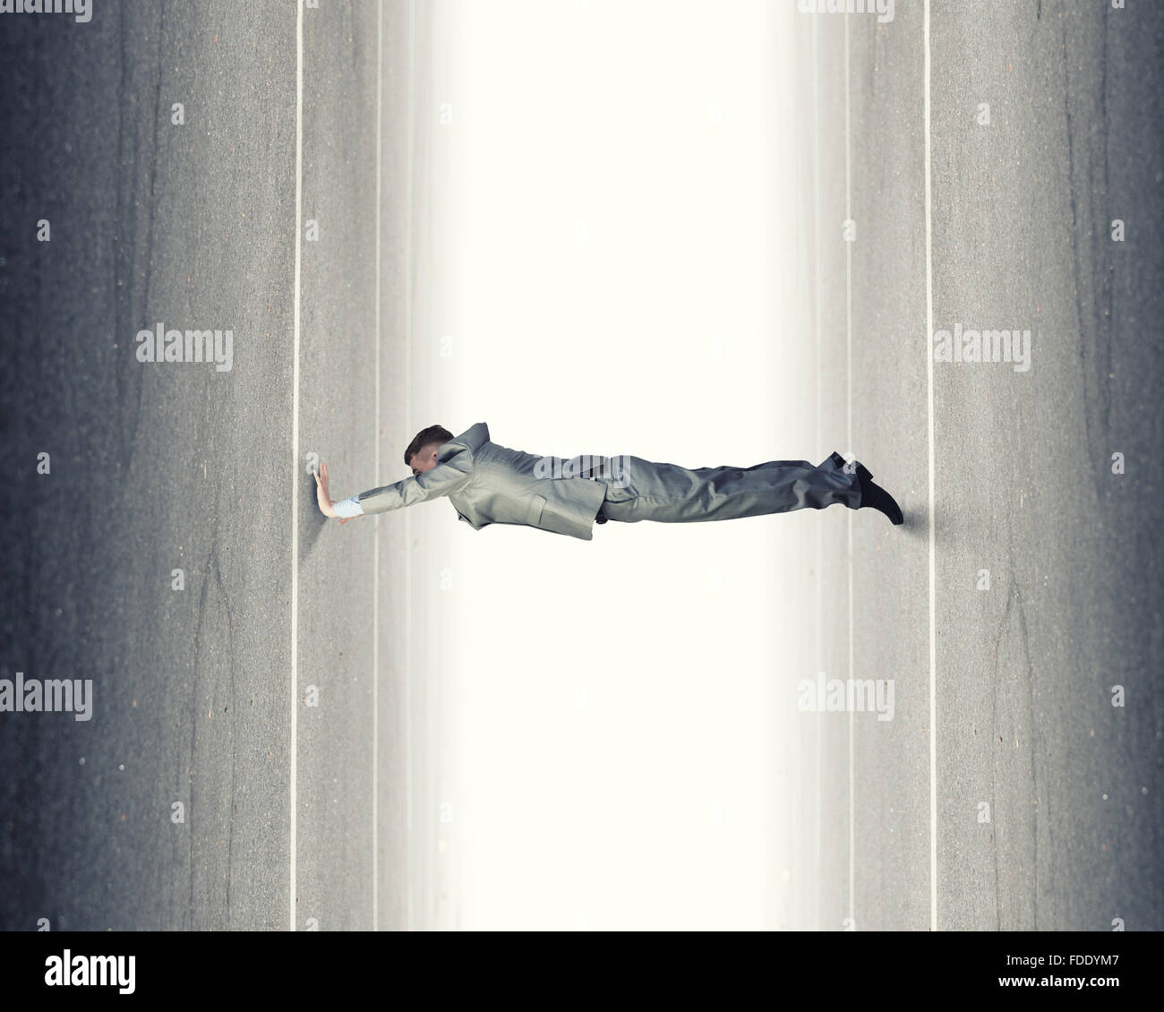 Young troubled businessman trapped between two walls Stock Photo - Alamy