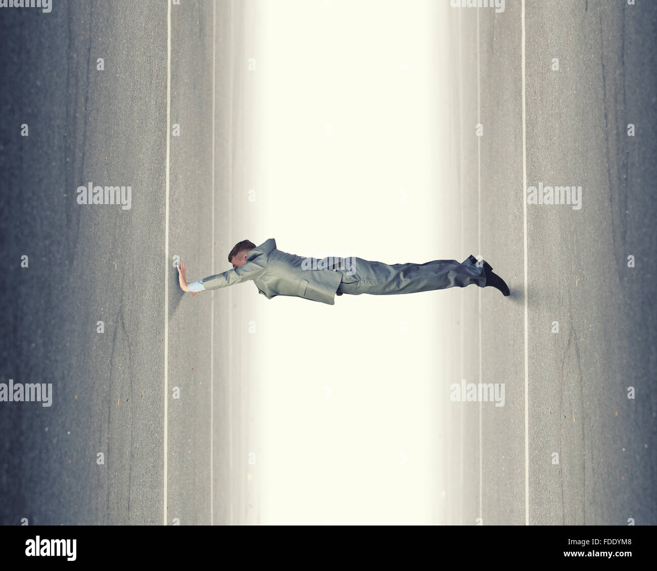 Young troubled businessman trapped between two walls Stock Photo - Alamy