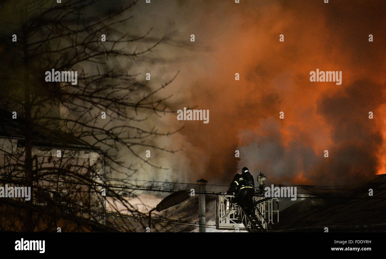 Moscow, Russia. 30th Jan, 2016. Fireman extinguish fire at a factory in ...