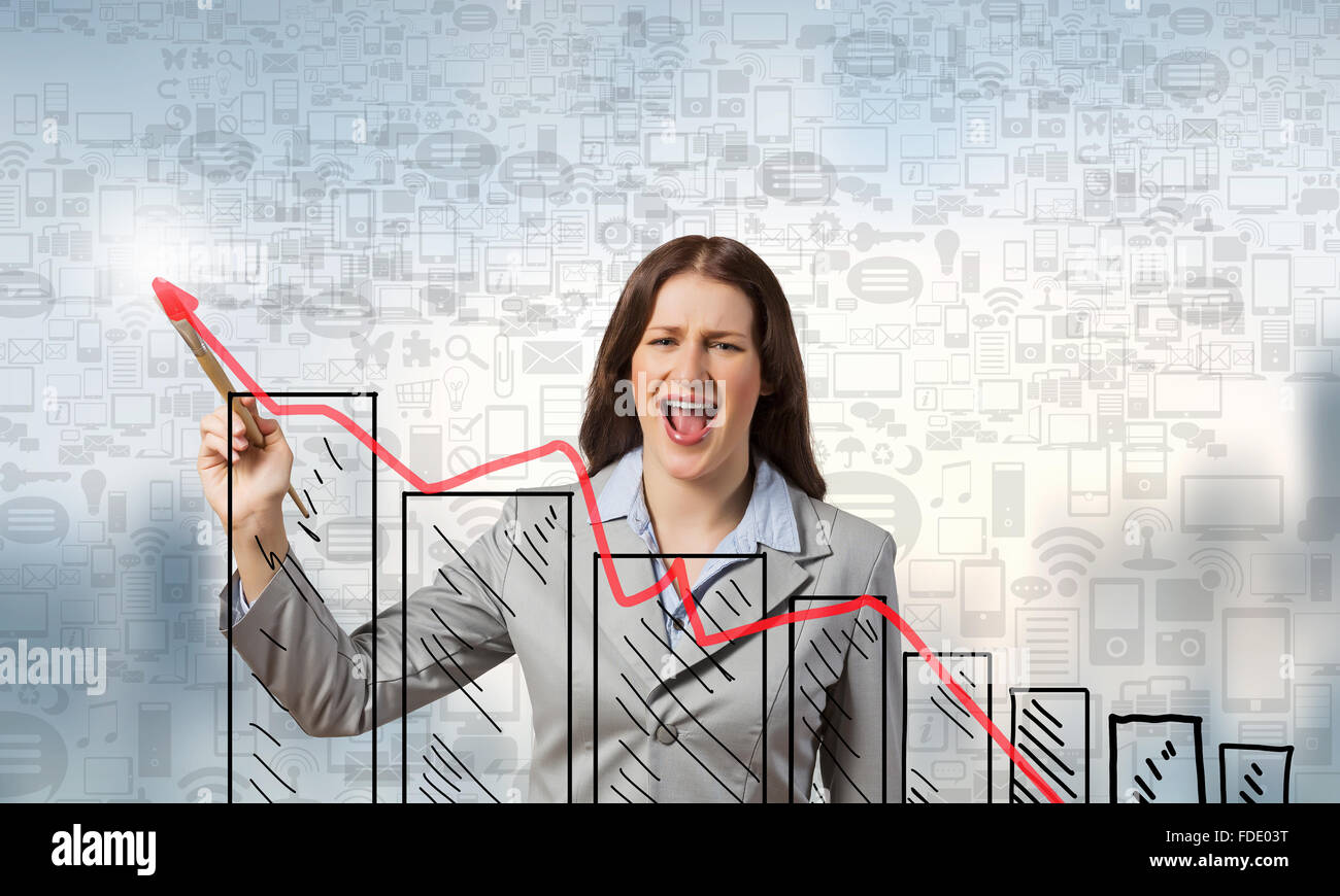Young businesswoman drawing increasing graph with paint brush Stock ...