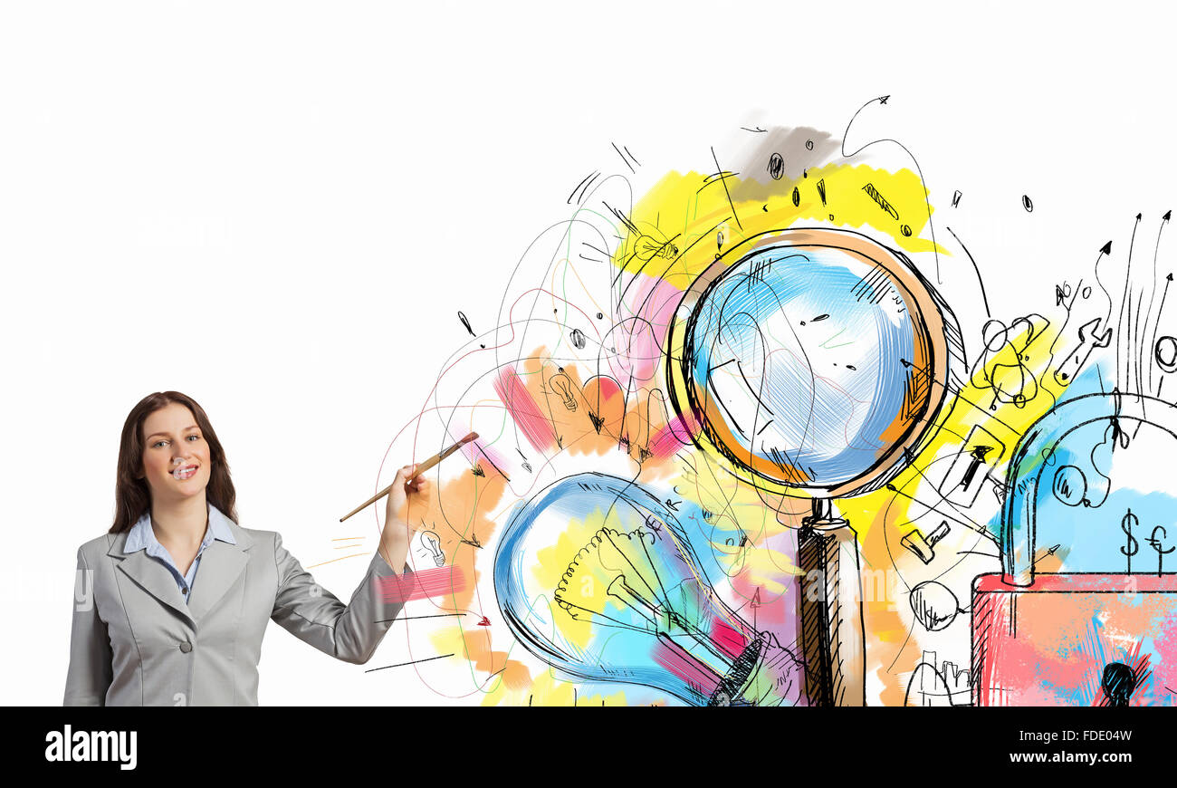Young pretty businesswoman holding paint brush. Creativity concept ...