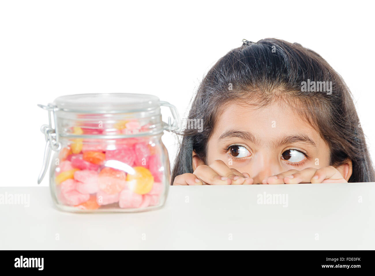 Child picking up sweets hi-res stock photography and images - Alamy
