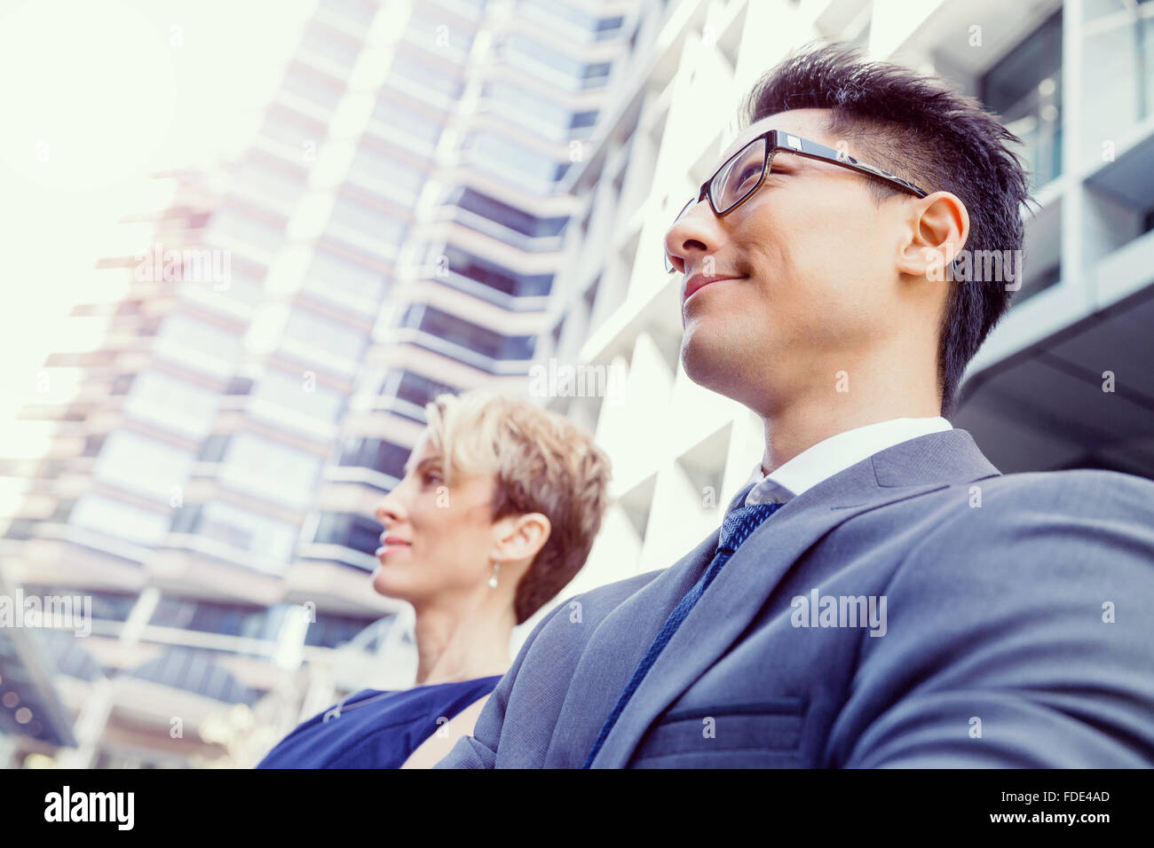 Businessteam members standing next to each other in business district ...