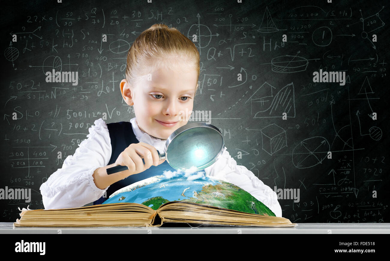 Magnifying glass examining earth hi-res stock photography and images ...