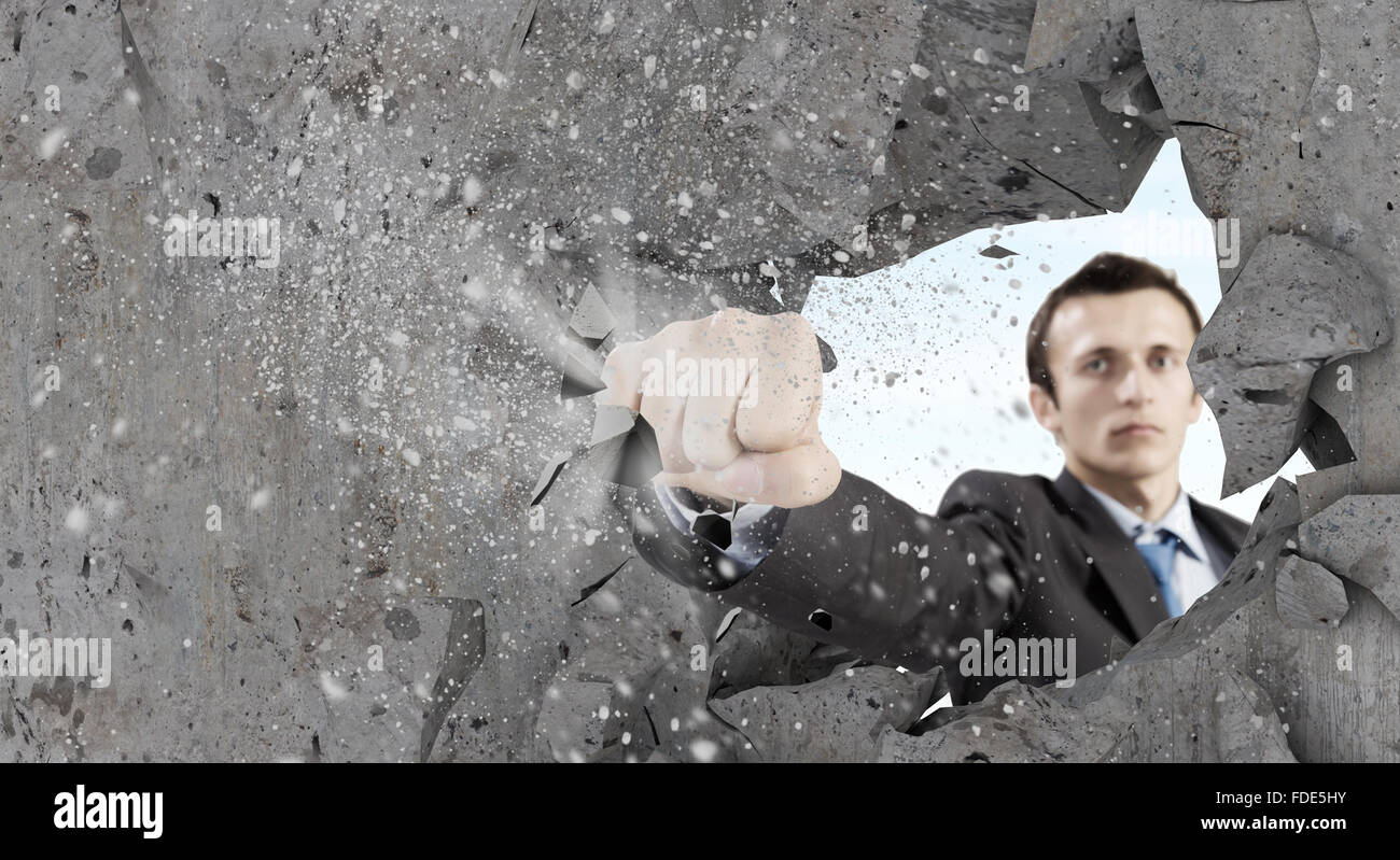 Businessman breaking stone wall karate hi-res stock photography and ...