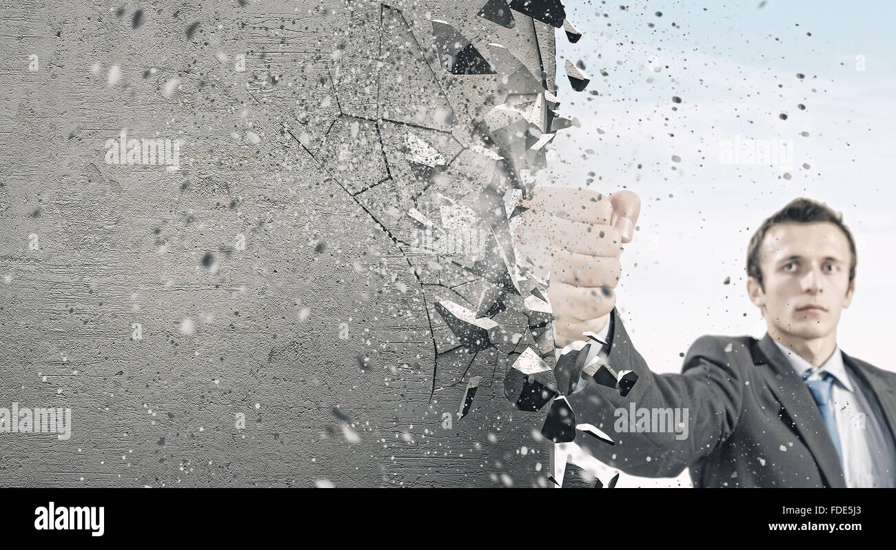 Businessman breaking stone wall karate hi-res stock photography and ...