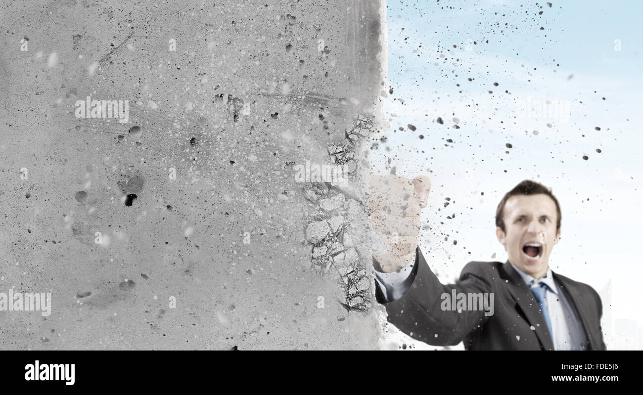 Businessman breaking stone wall karate hi-res stock photography and ...