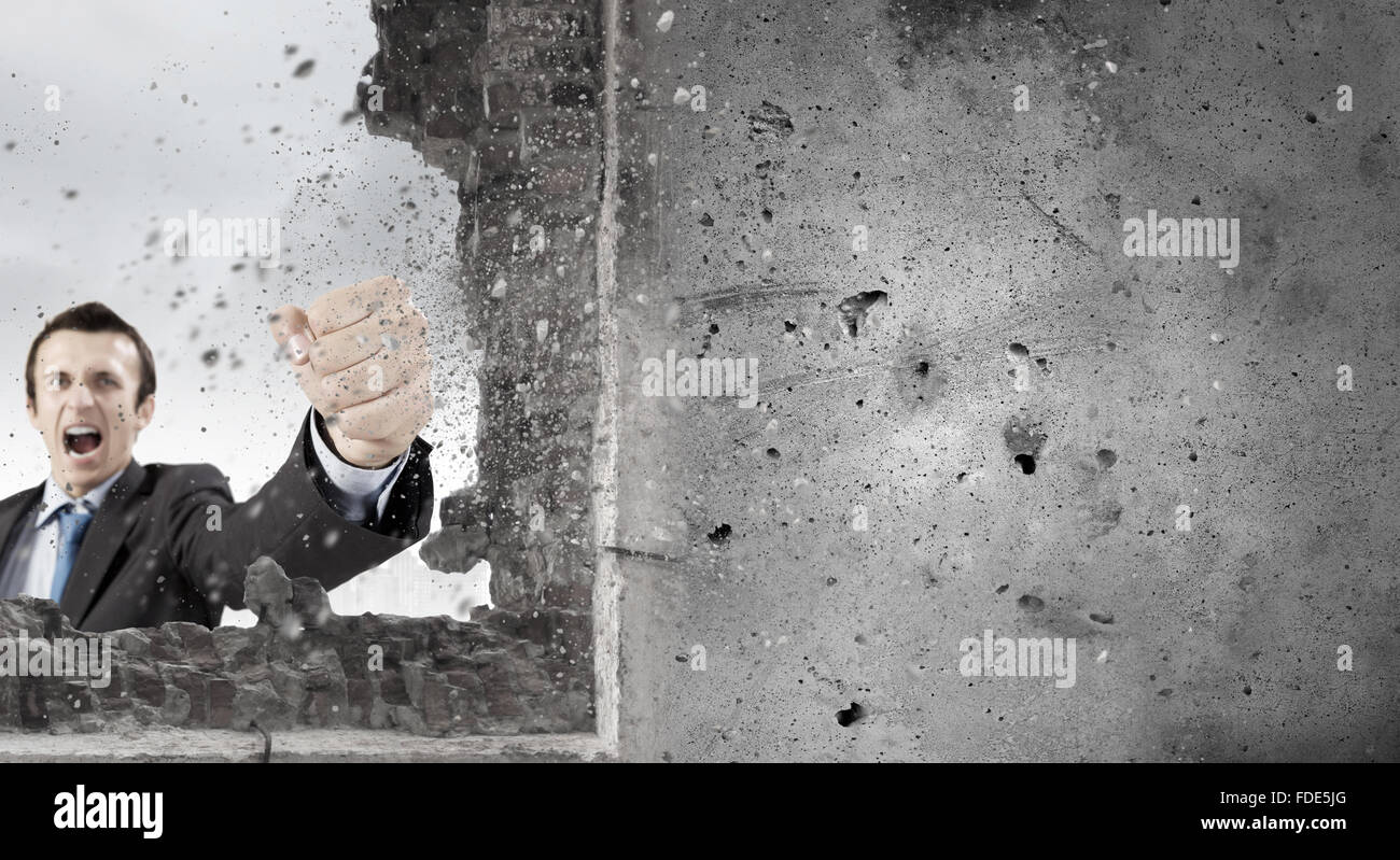 Businessman breaking stone wall karate hi-res stock photography and ...