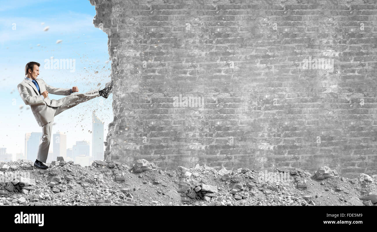 Businessman breaking stone wall karate hi-res stock photography and ...