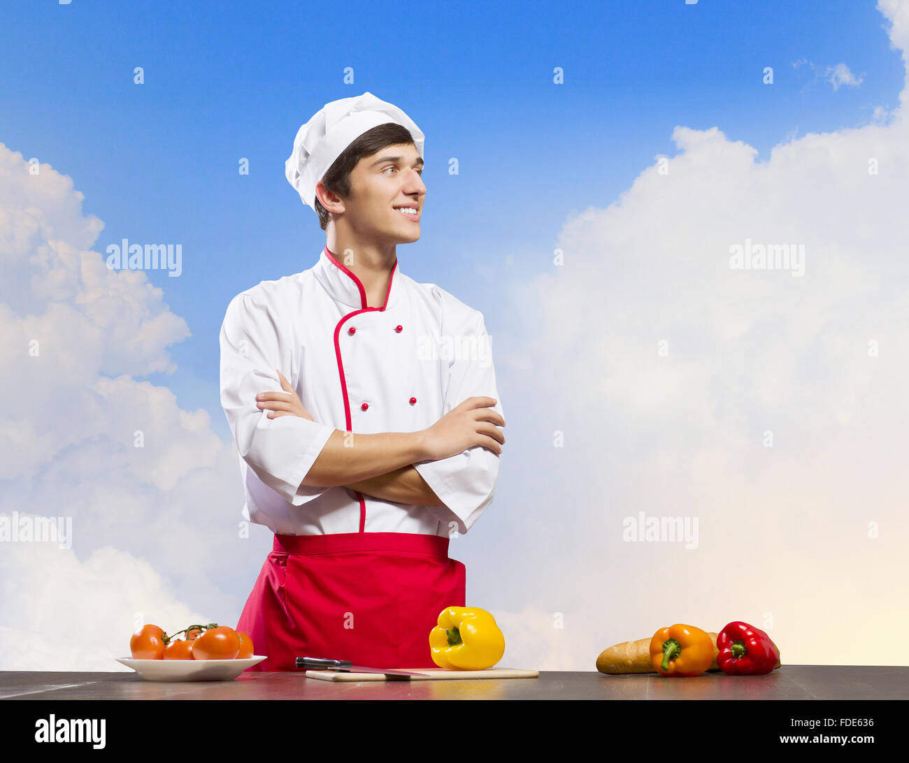 Young cheerful cook and ingredients flying in air Stock Photo - Alamy