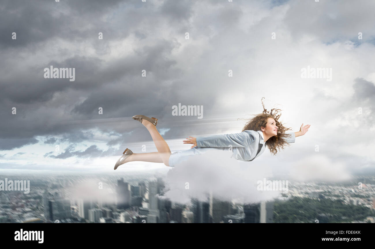Young determined businesswoman flying high in sky Stock Photo - Alamy