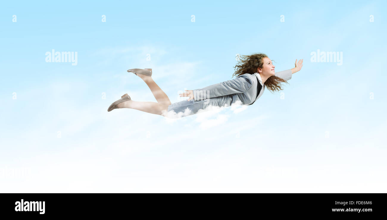 Young determined businesswoman flying high in sky Stock Photo - Alamy
