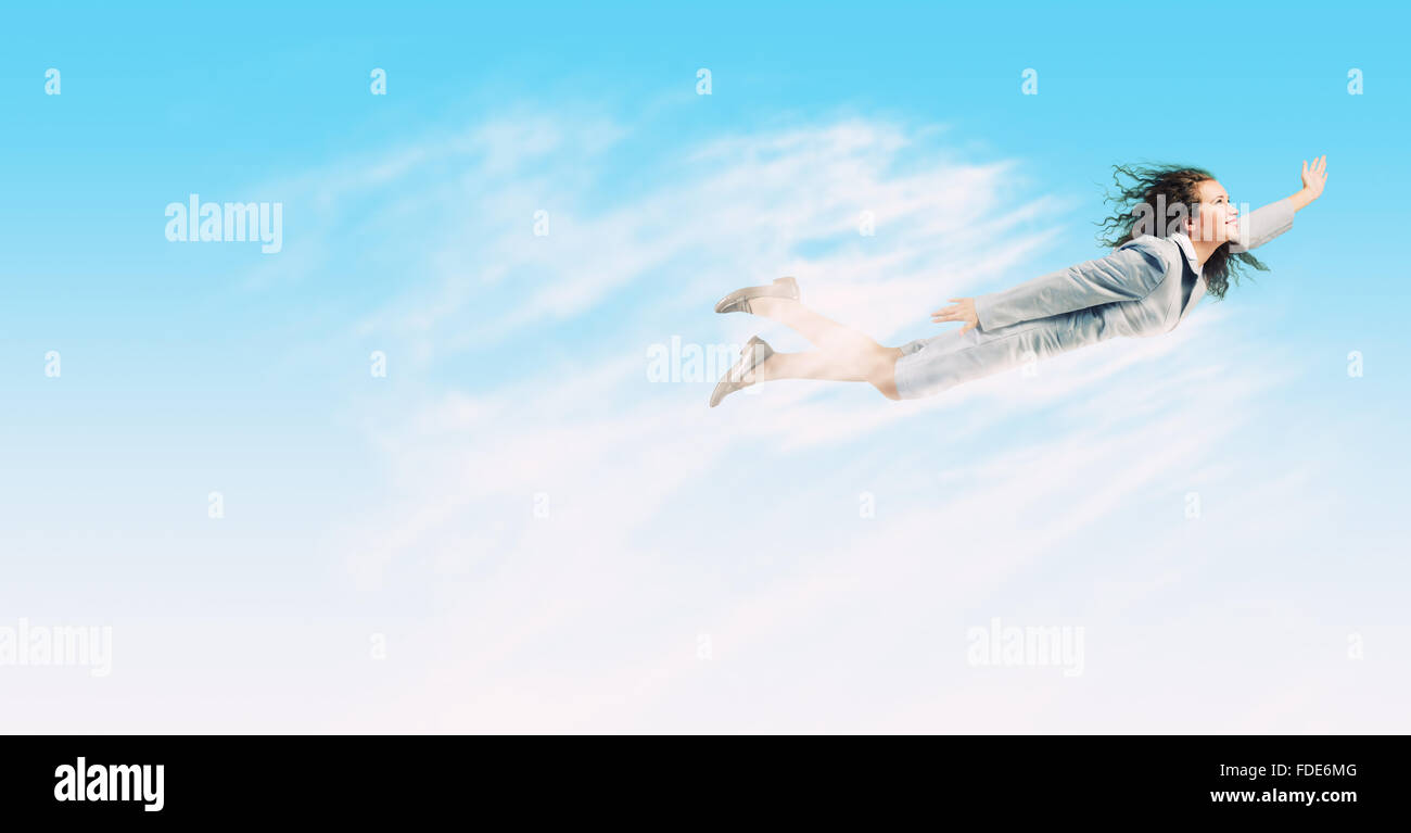 Young determined businesswoman flying high in sky Stock Photo - Alamy