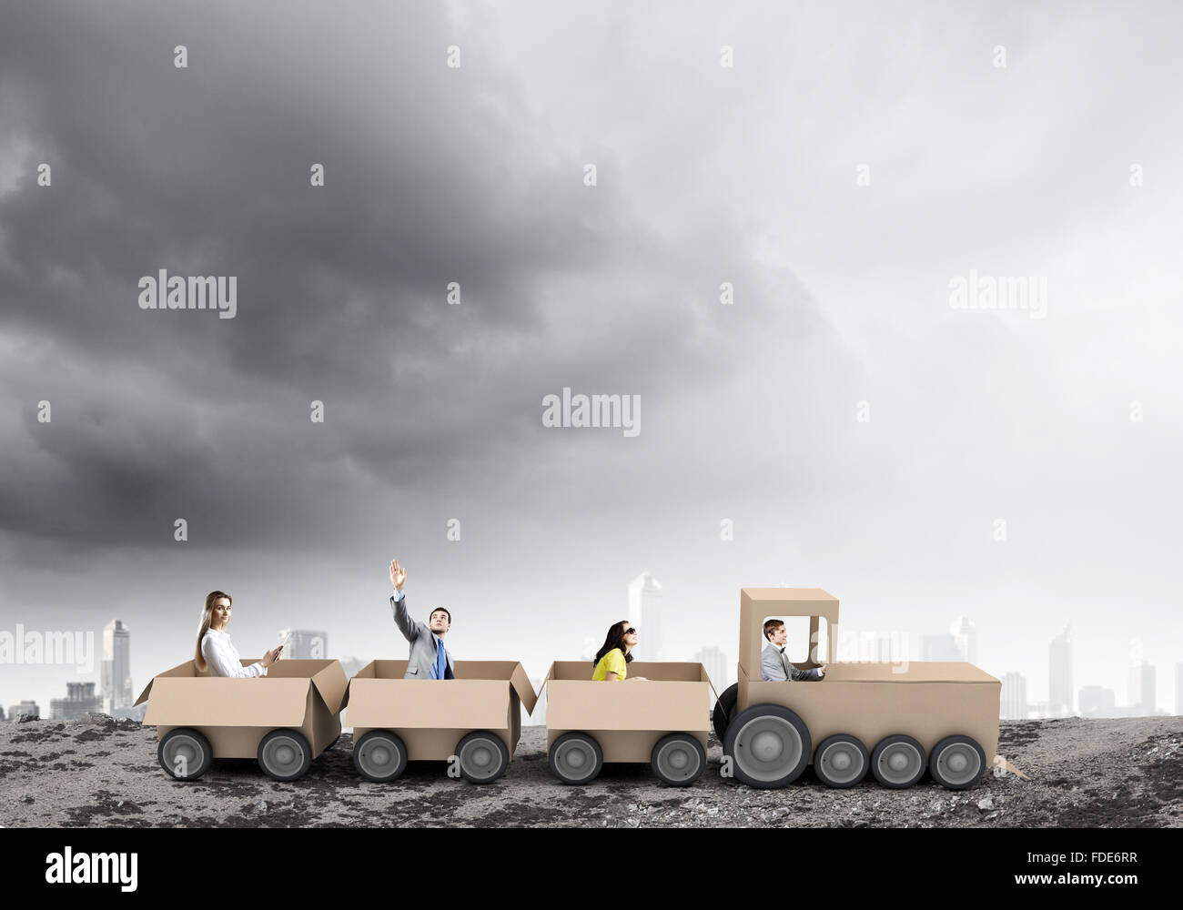 Young business people riding carton train. Teamwork concept Stock Photo ...