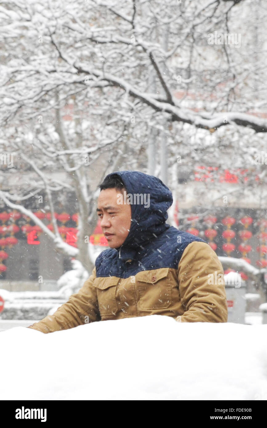 Xi'an, China's Shaanxi Province. 31st Jan, 2016. A man rides in snow in ...