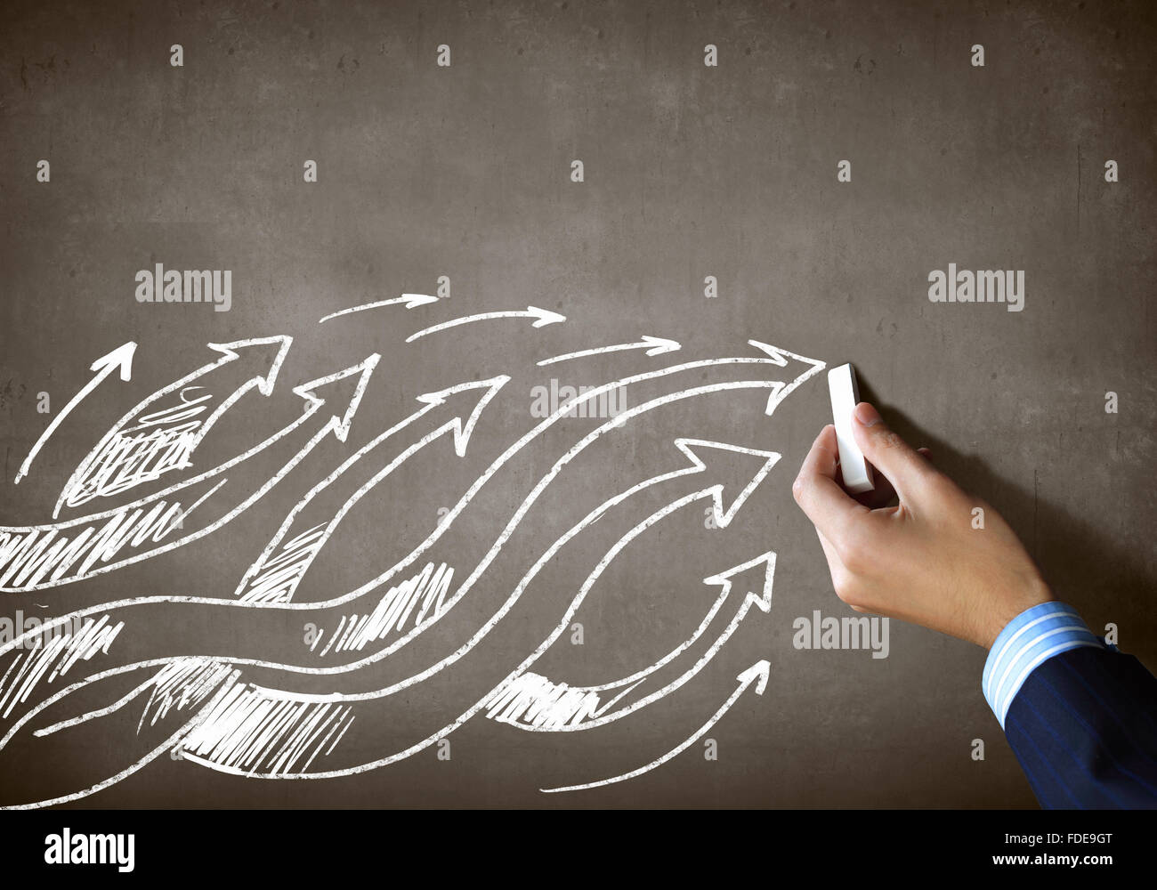 Close up of human hand drawing arrows Stock Photo - Alamy