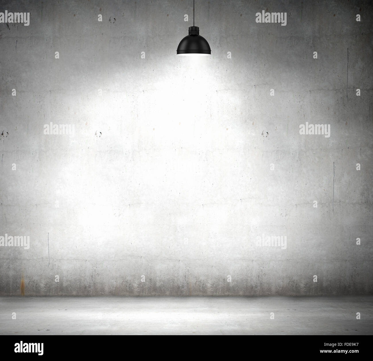 Stone blank wall illuminated with hanging above lamp. Place for text ...