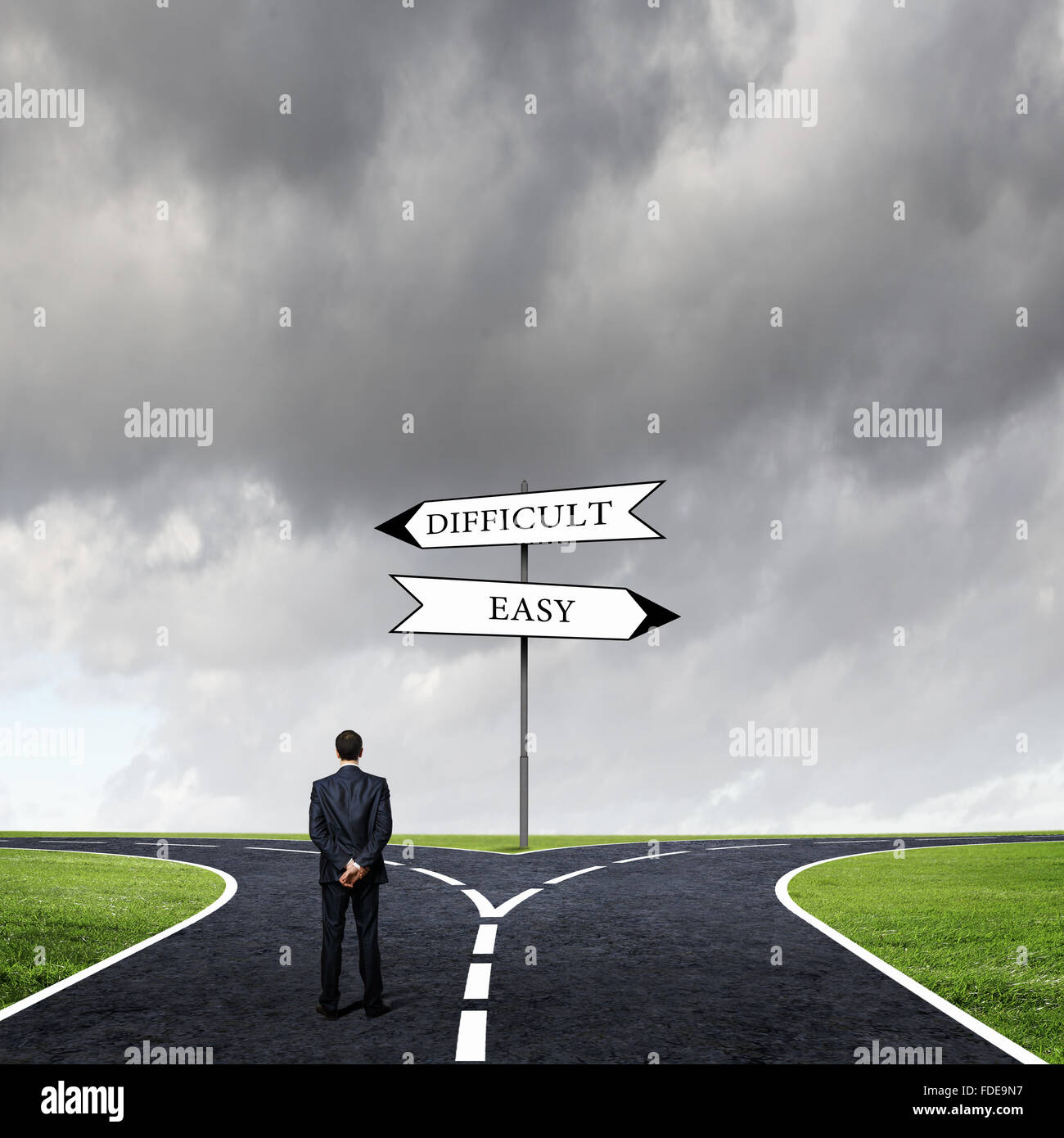 Back view of businessman standing at crossroads. Choice concept Stock ...