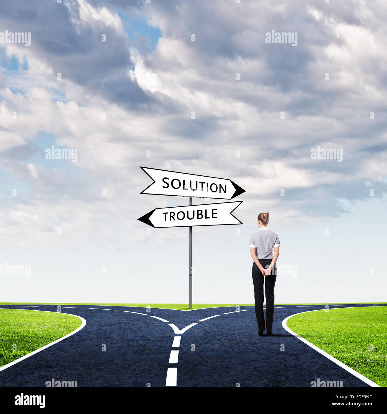 Back view of businesswoman standing at crossroads. Choice concept Stock ...