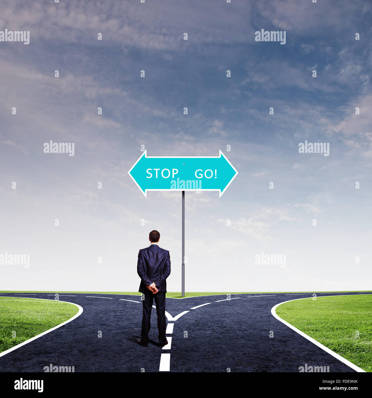 Back view of businessman standing at crossroads. Choice concept Stock ...